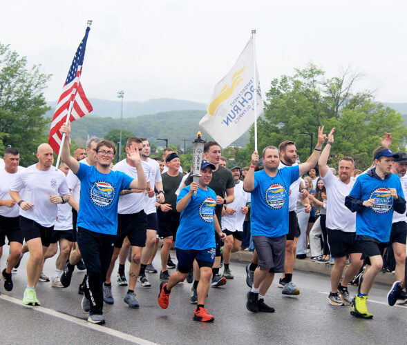 Olympic effort: Special Olympians join police officers in leg of Law ...
